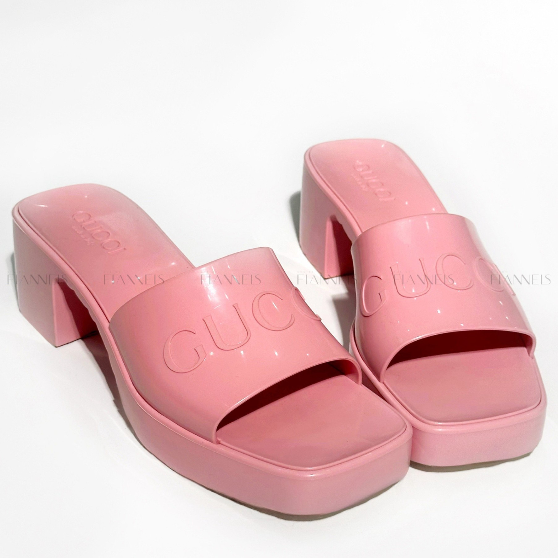 Gucci Mules With Embossed Logo In Wild Rose Rubber - 624730J8700